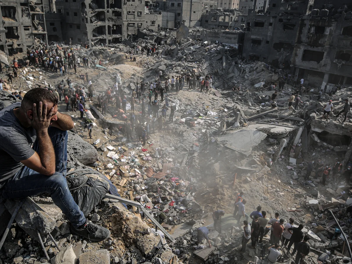 Dozens Trapped Under Rubble After Overnight Israeli Bombardment in Al ...